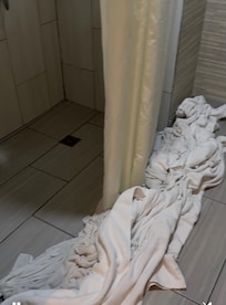 What we had to do every time we took a shower to prevent from flooding the room.