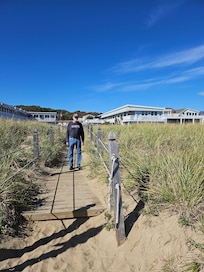 The boardwalk and hotel in the back on the right
