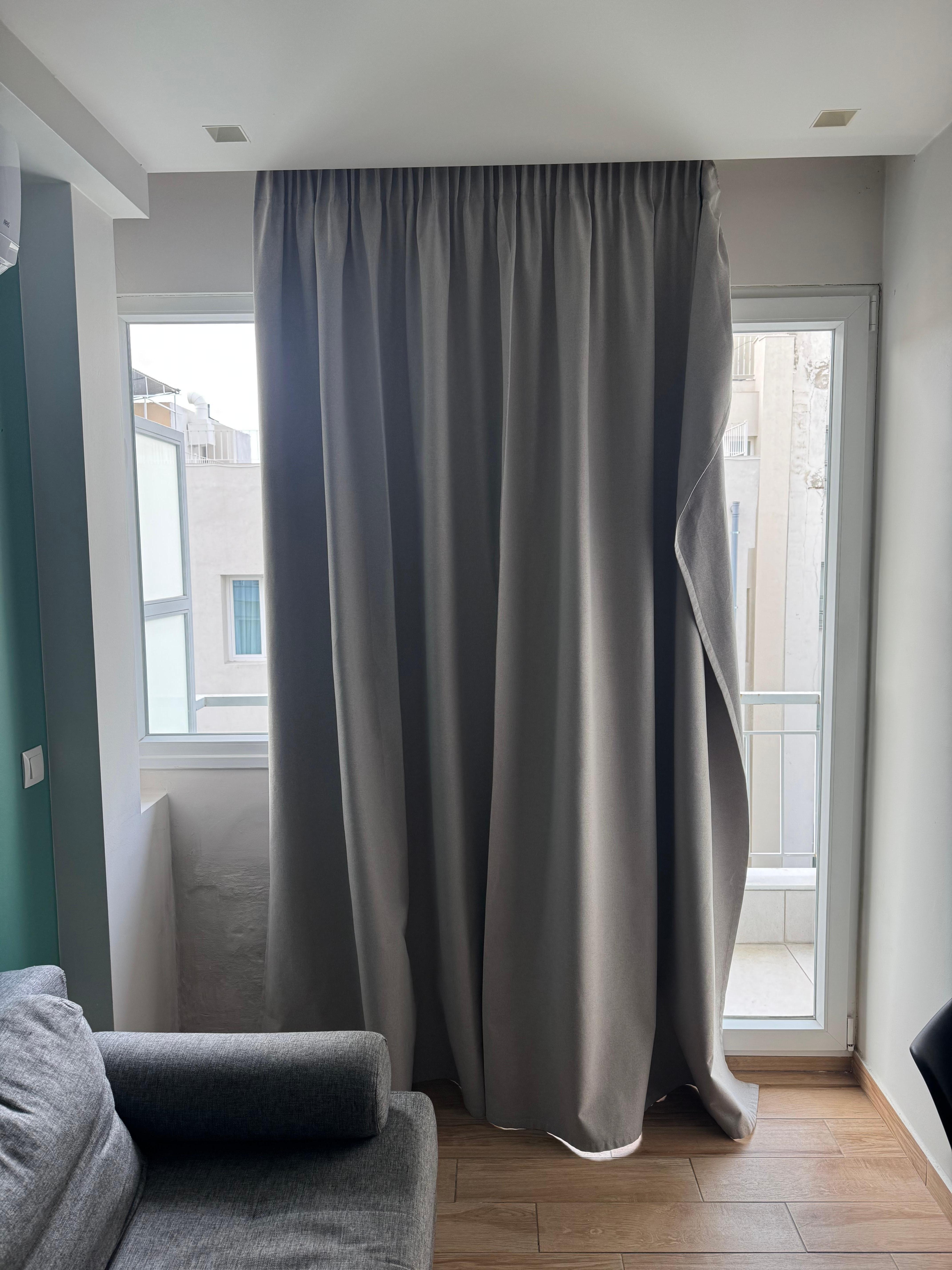 Curtain that didn’t cover the windows and provided zero privacy and allowed light