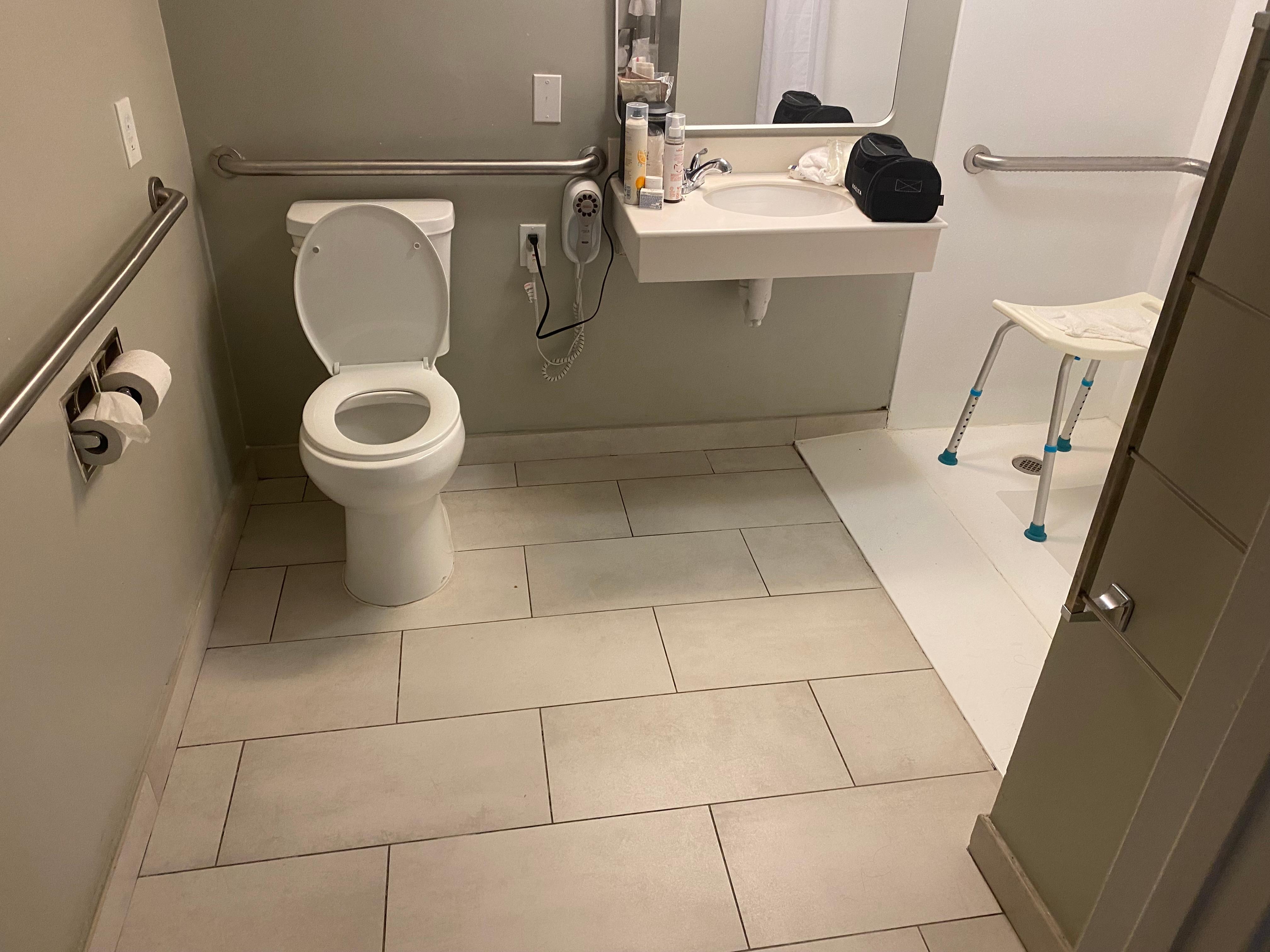 This is where the flood started. It was clear a design flaw. There is no drain in the middle of the bathroom. Only at the front of the shower