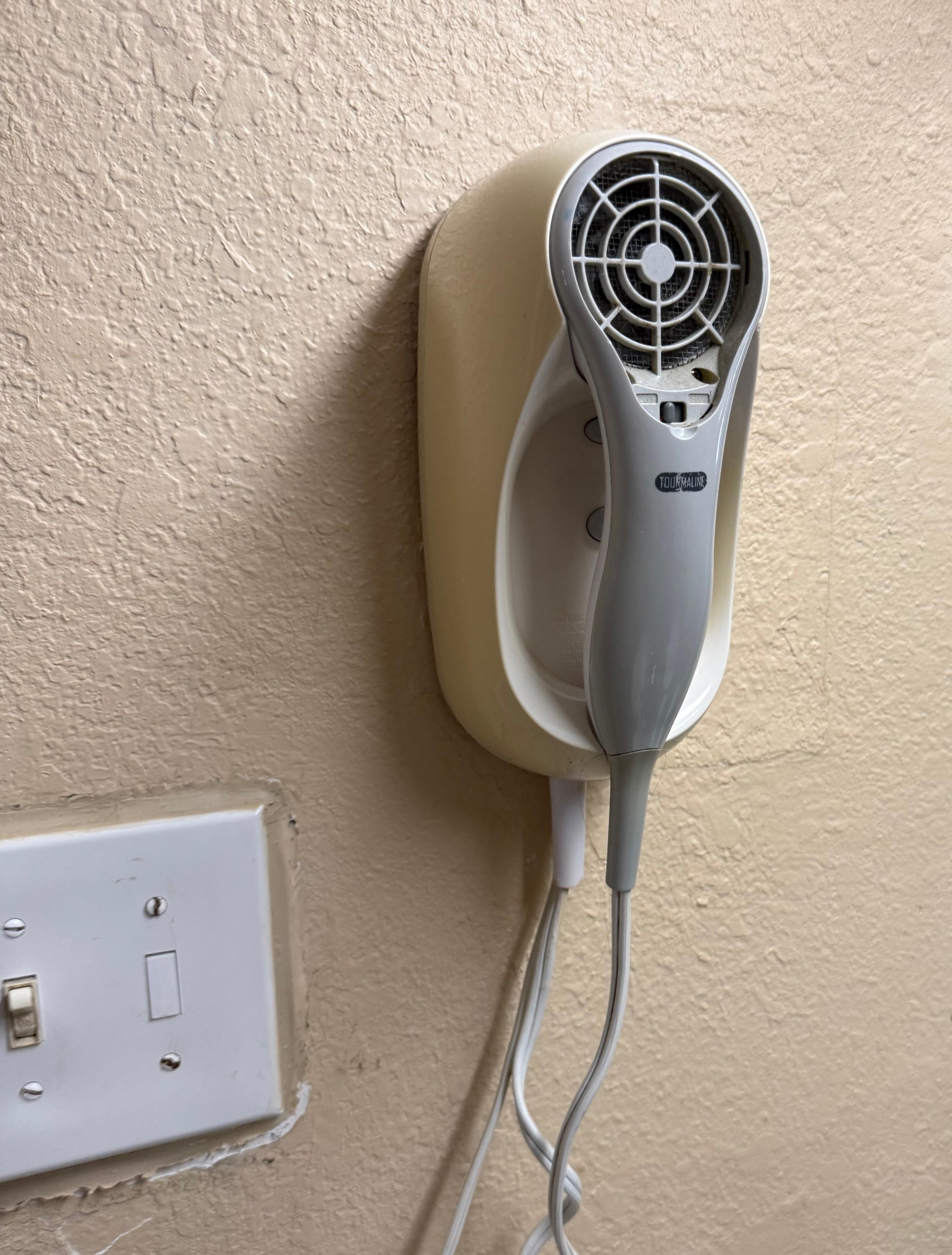 Walls not painted... very old hair dryer...creepy