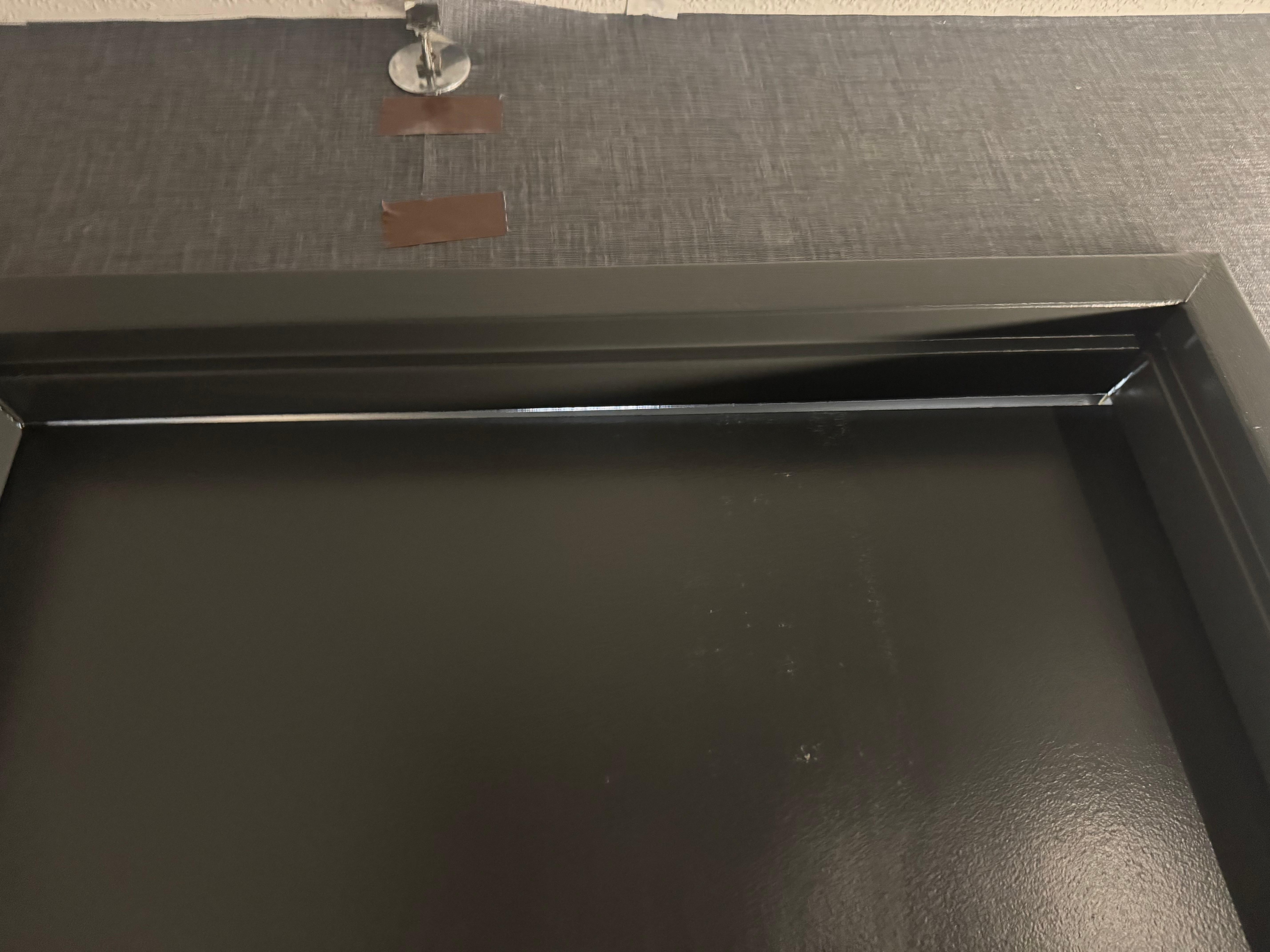 Room 220 door closed and yet looking open on the top 