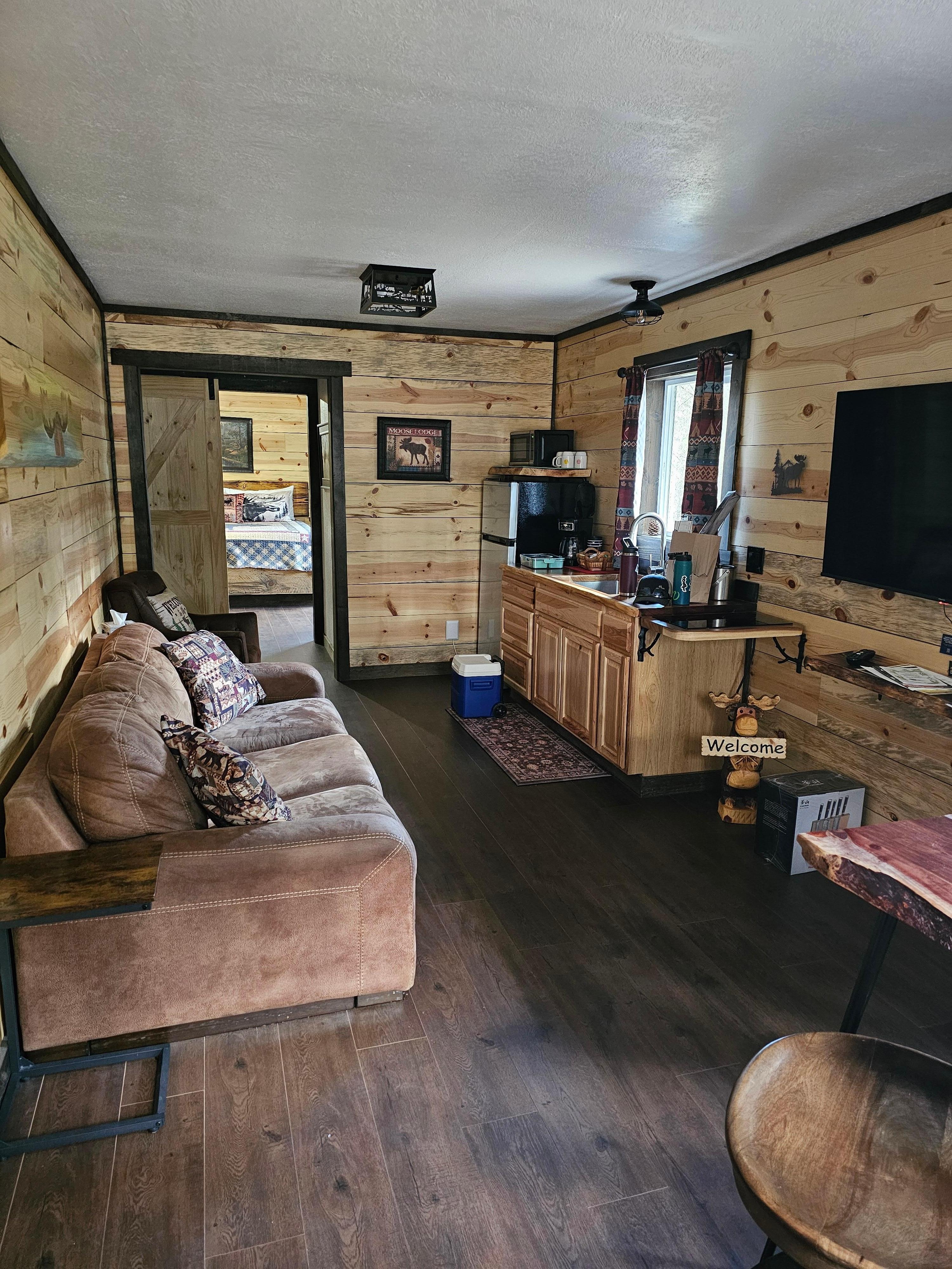 Living room and a dining table with chairs
This is a 2 bedroom unit with 2 bathrooms. Small kitchenette.  United #10.