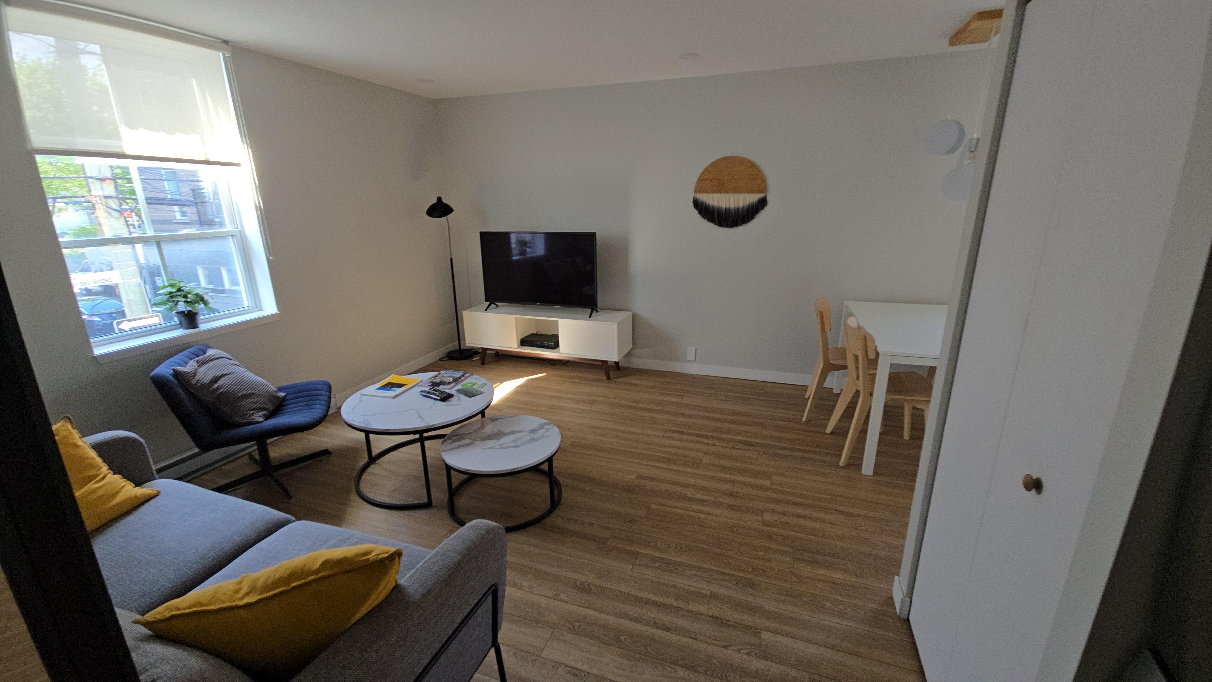 View of Living room from the door of apartment. Bedroom doors are on left and right from the entry of apartment (can't see them from this photo)