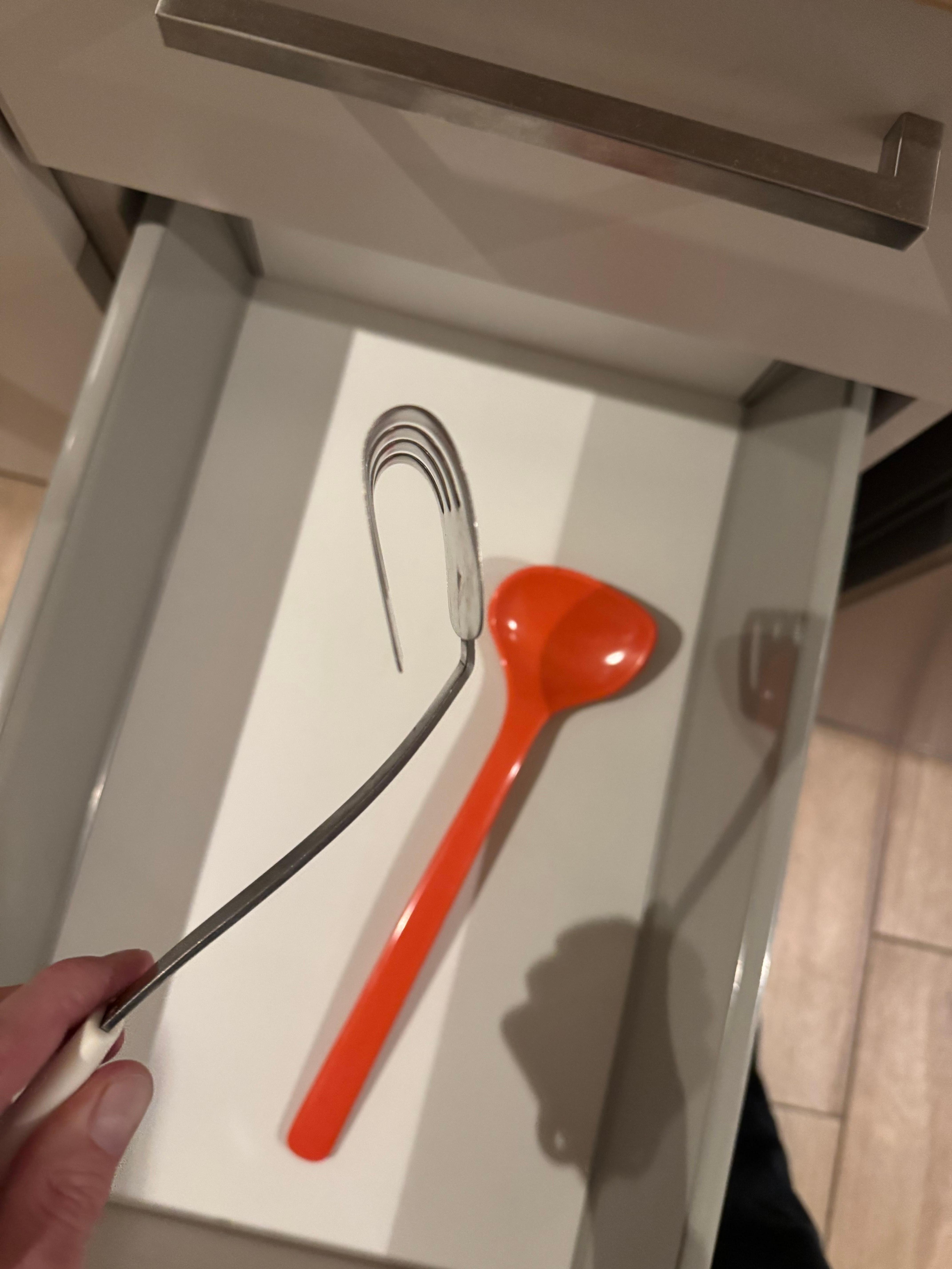 Unusable utensils. Spatula folded in half 