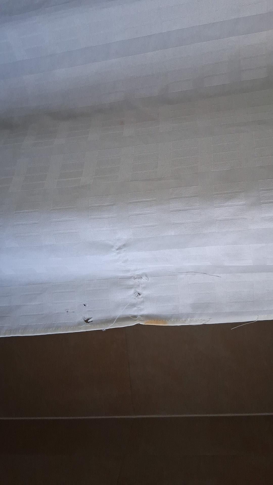 Curtain was stained and had a burn mark