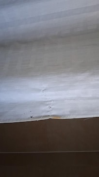 Curtain was stained and had a burn mark