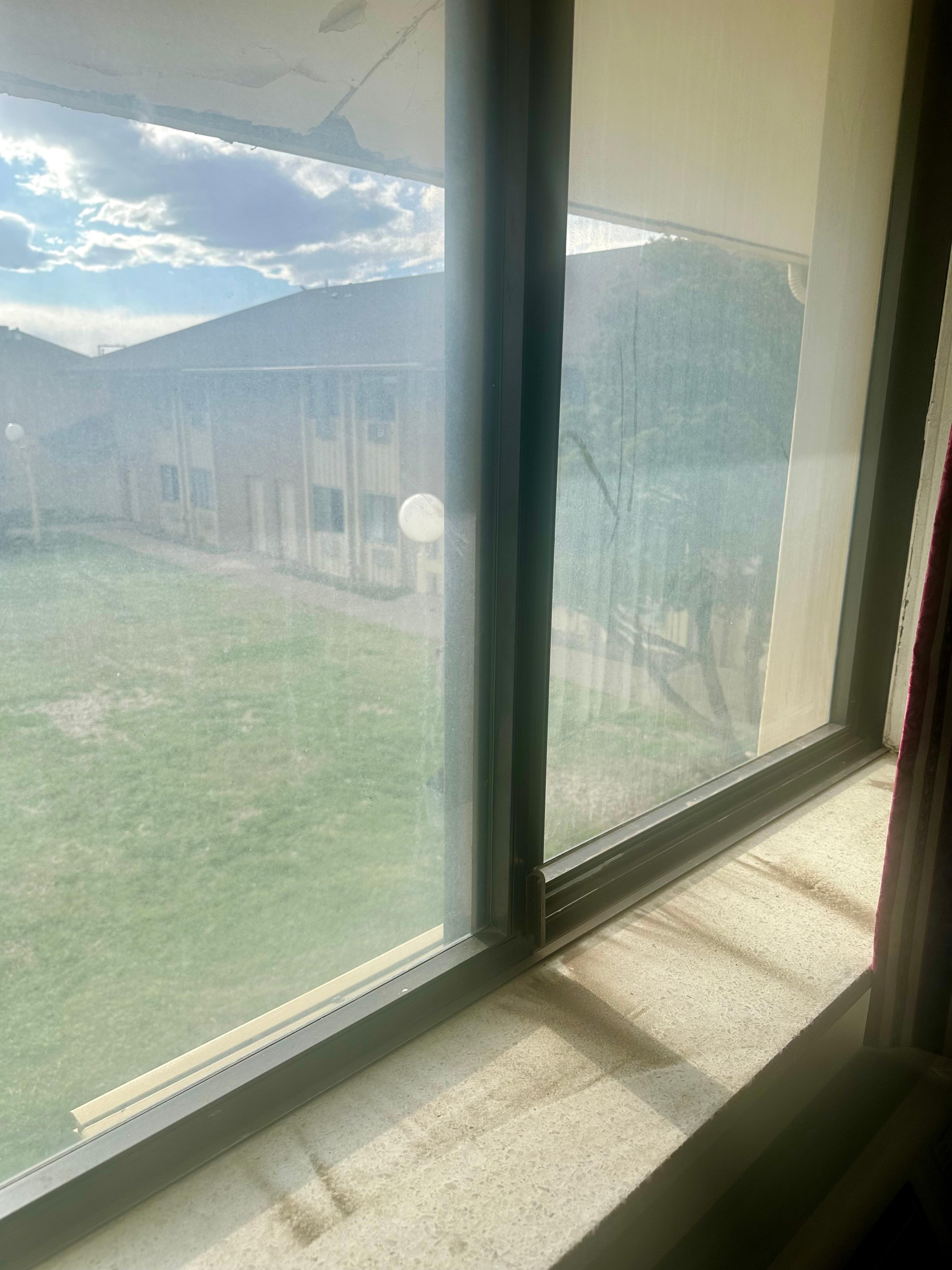 Dirt streaks from leaky windows on sill. Dirty windows. 