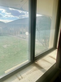Dirt streaks from leaky windows on sill. Dirty windows.