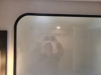 Curse word upper left of mirror