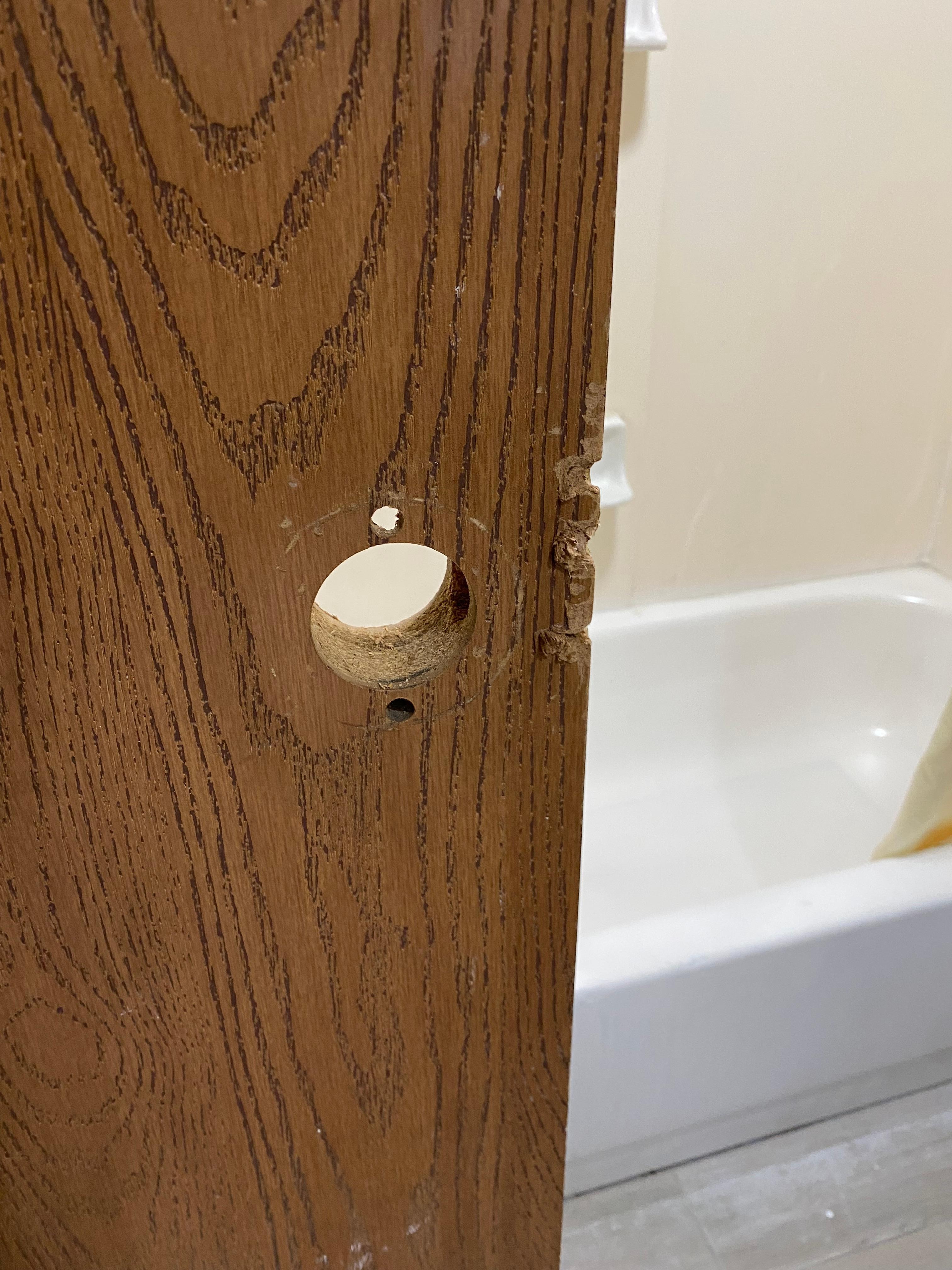Bathroom door. Ironically, the tub was the cleanest thing in the room. But the water pressure was nil