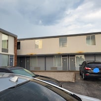 Motel/hotel. Rust & notice missing window top left.