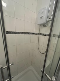 Mouldy grout and really small shower that didn’t work properly