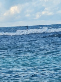 Surfer on elevated surfboard