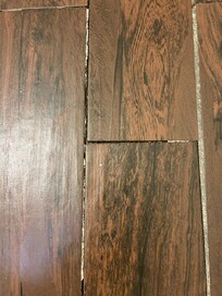 The grout was missing so when you stepped just so, the tile moved!