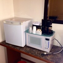 Fridge, microwave and coffee maker.
