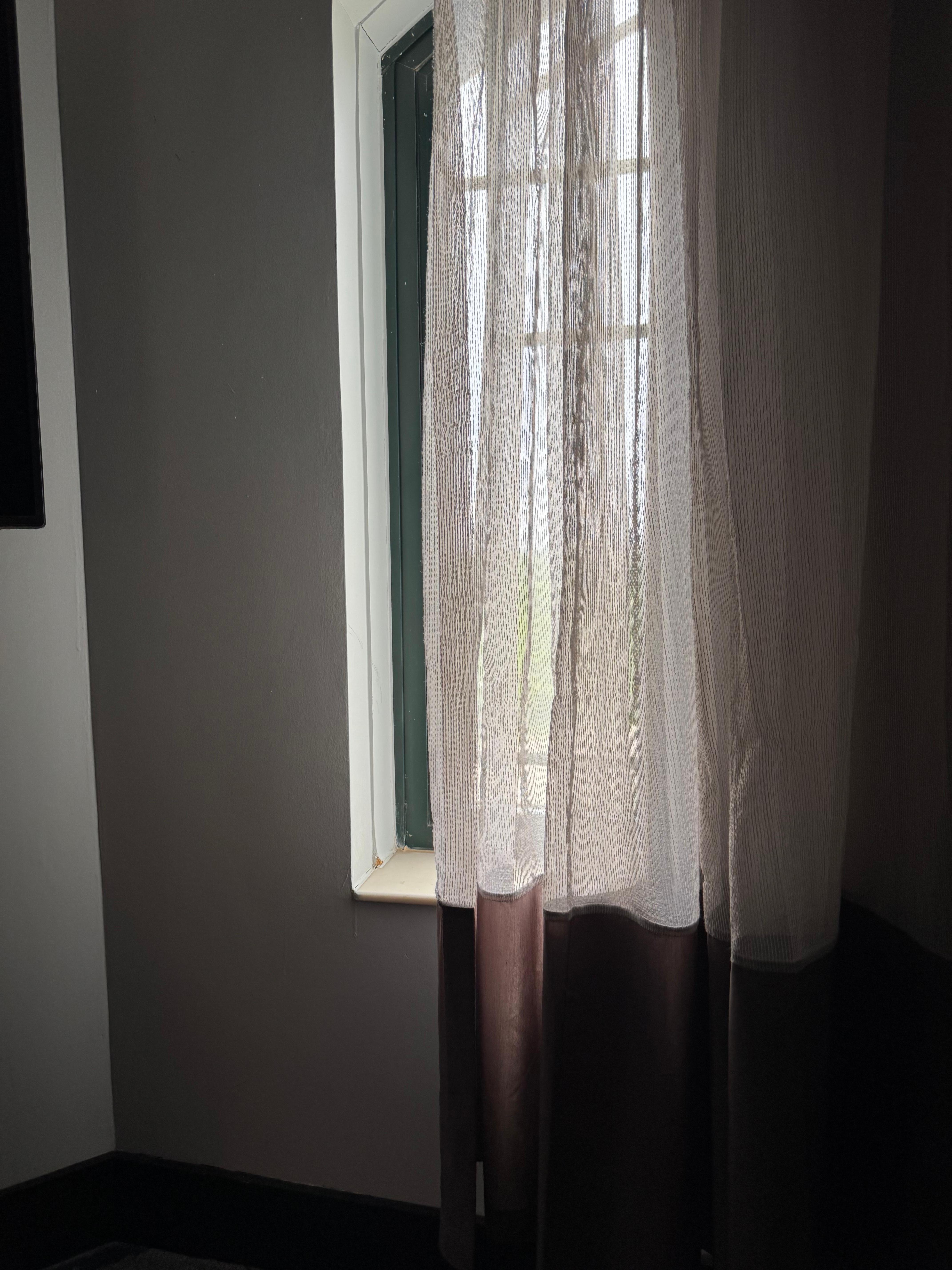 Missing dark out curtain in bedroom. 