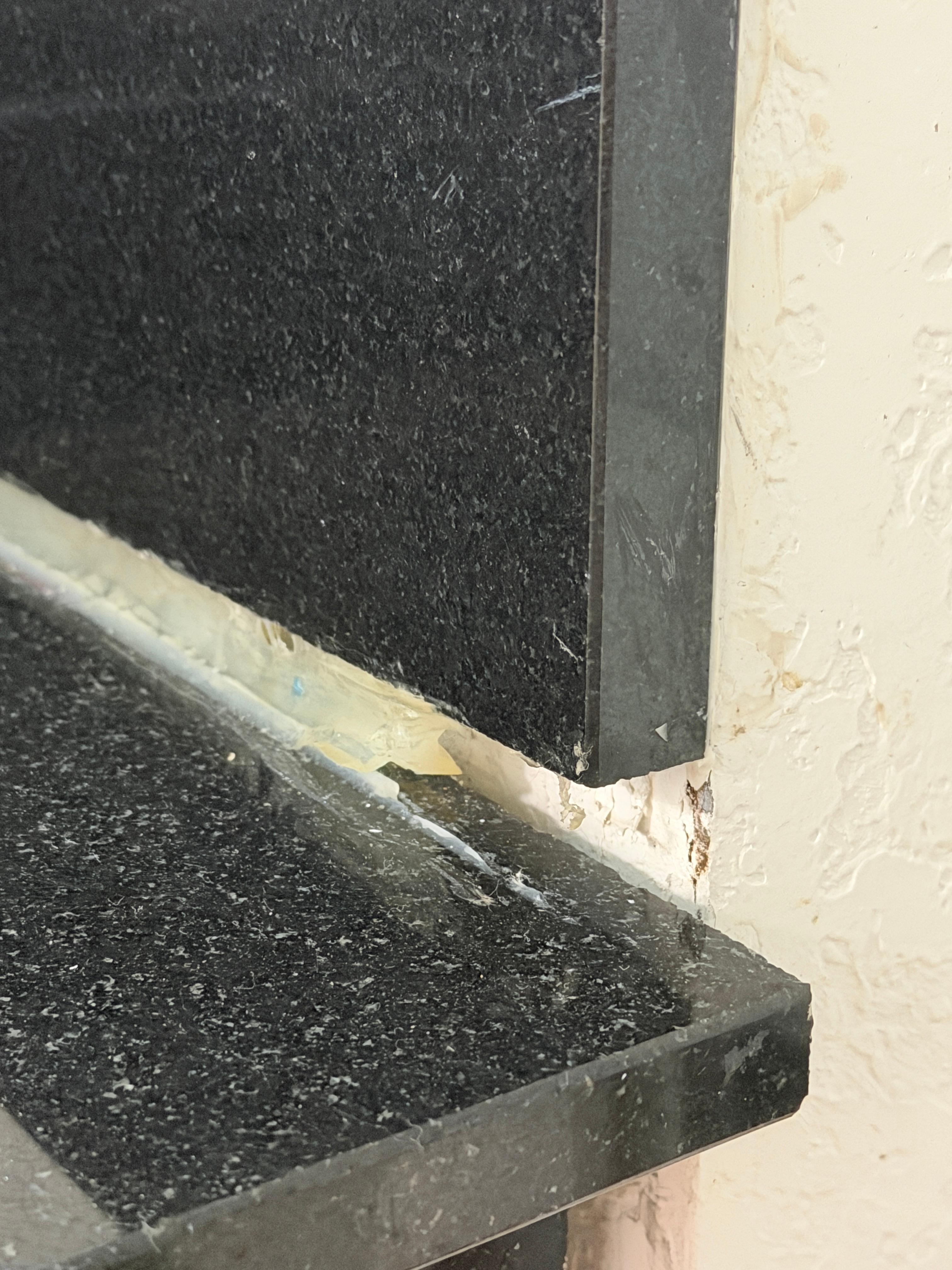 the bathroom counter andverticl is back splash