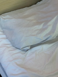 The pillow case was gray for ground in dirt
