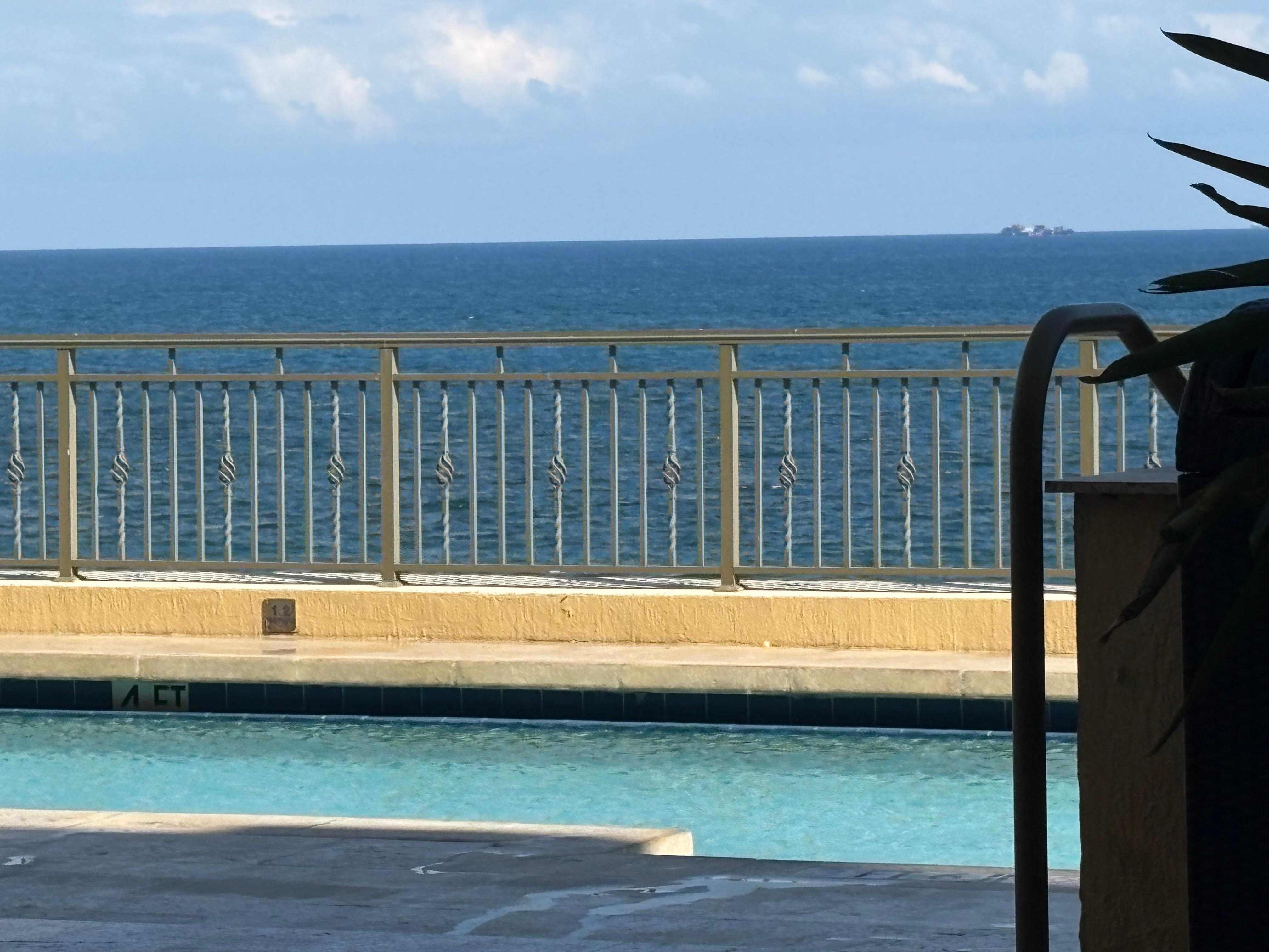 View of the ocean and pool at the hotel.