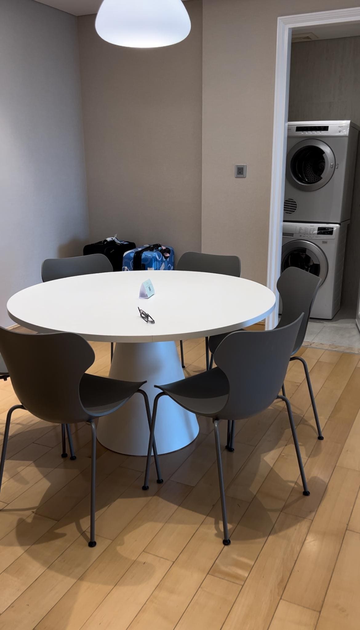 Dining place and washing machine in the background