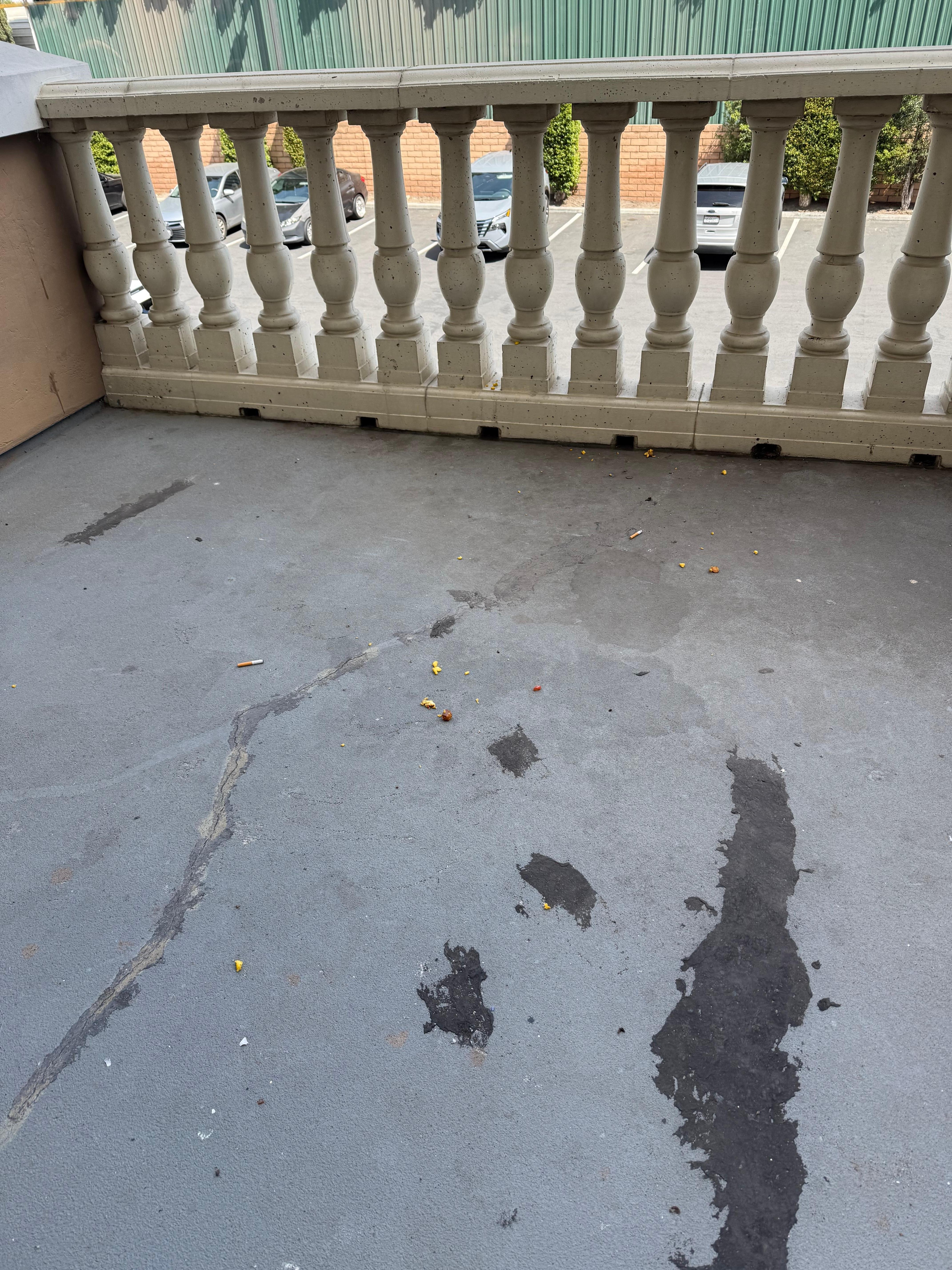 Food and cigarettes on our balcony from our upstairs neighbor.