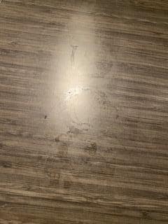 Coffee grounds and rings on the side table when we arrived