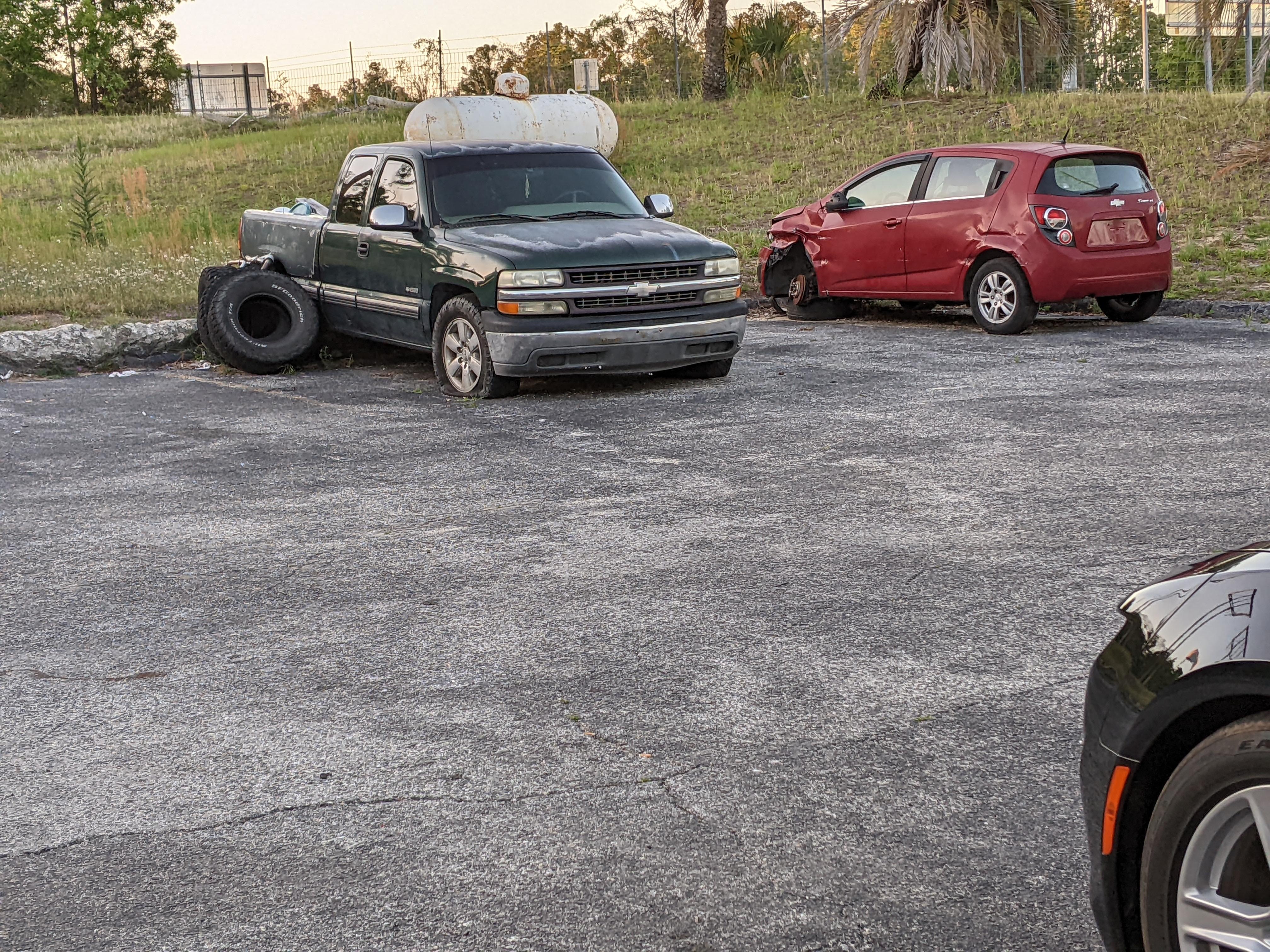 Vehicles in back parking area.