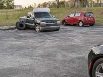 Vehicles in back parking area.