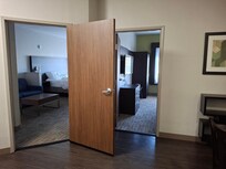 1 bedroom suite is actually a 2-bedroom, each with a door connecting to the central entry with table, microwave, coffee maker (no tv & sparse decorations)
