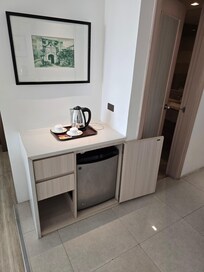 Mini-fridge w/ coffee maker.