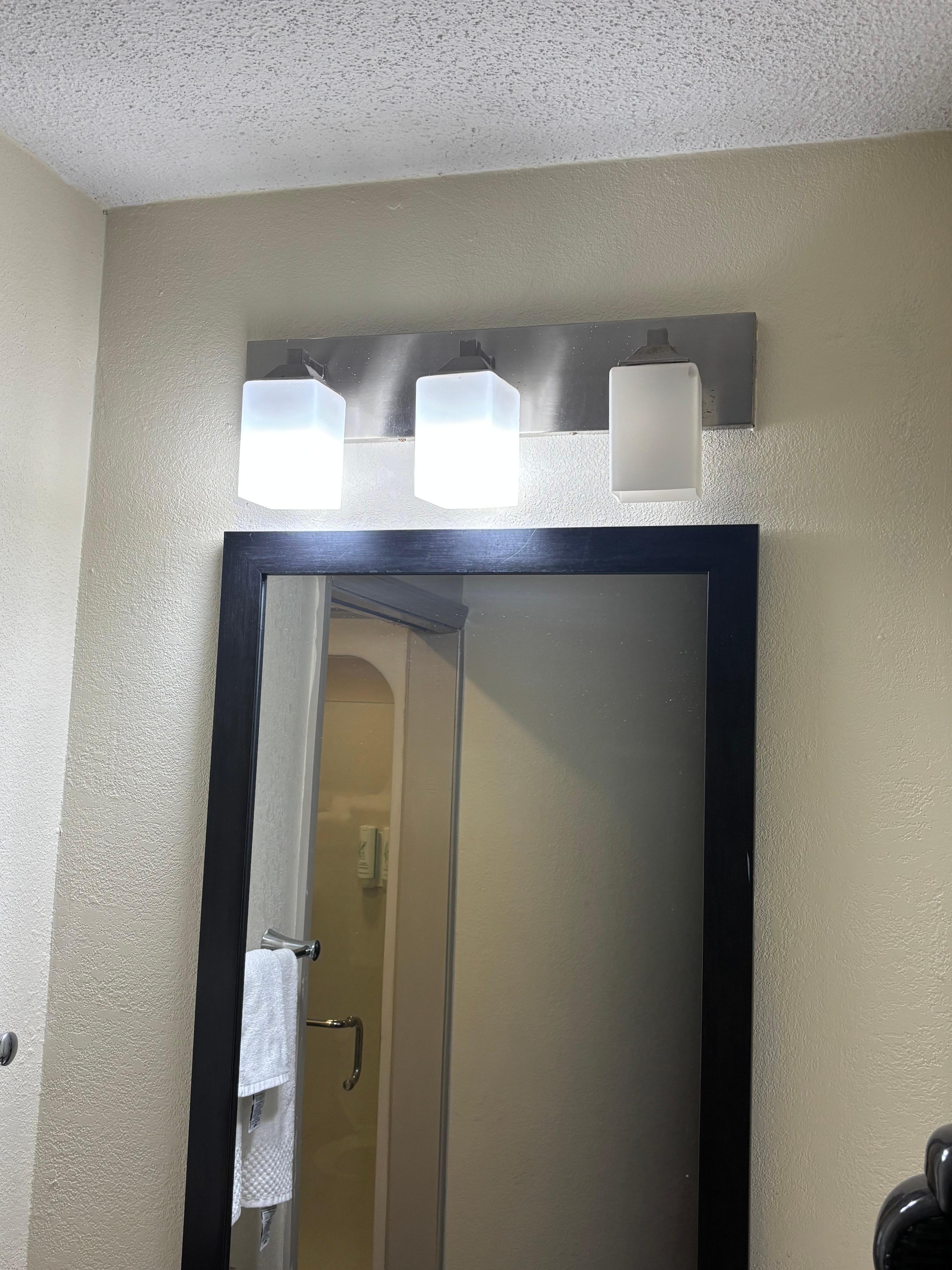 Lightbulb out the mirror had not been cleaned