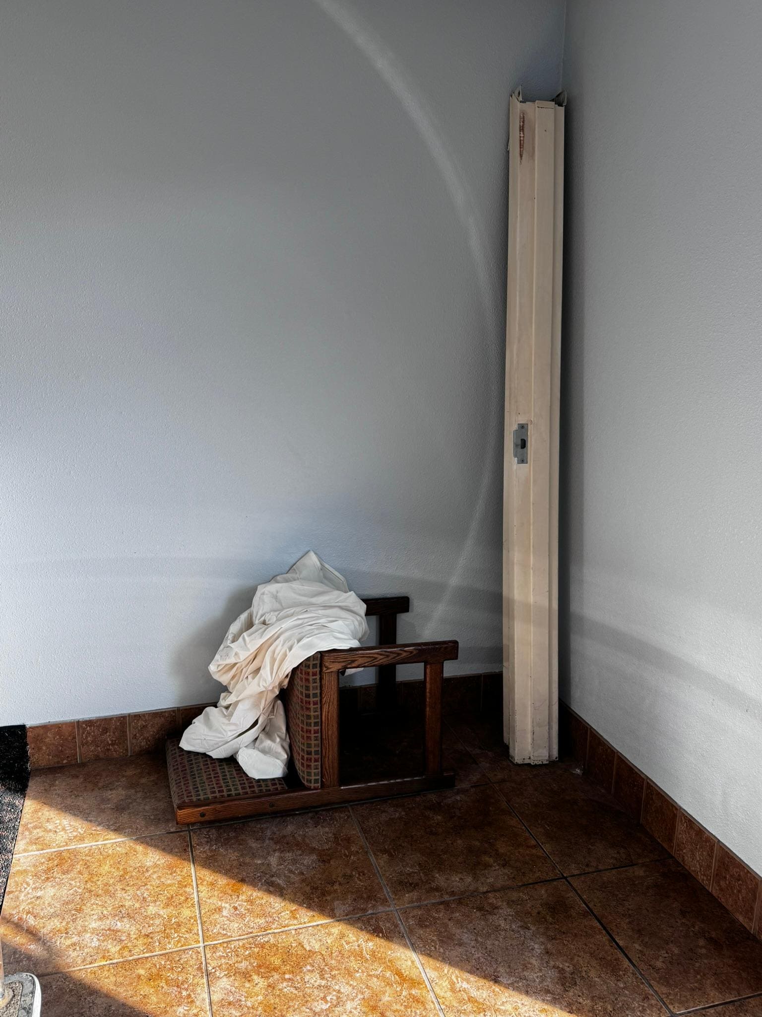 Materials and dirty linens stored in guest hallway creating cleanliness and safety concerns