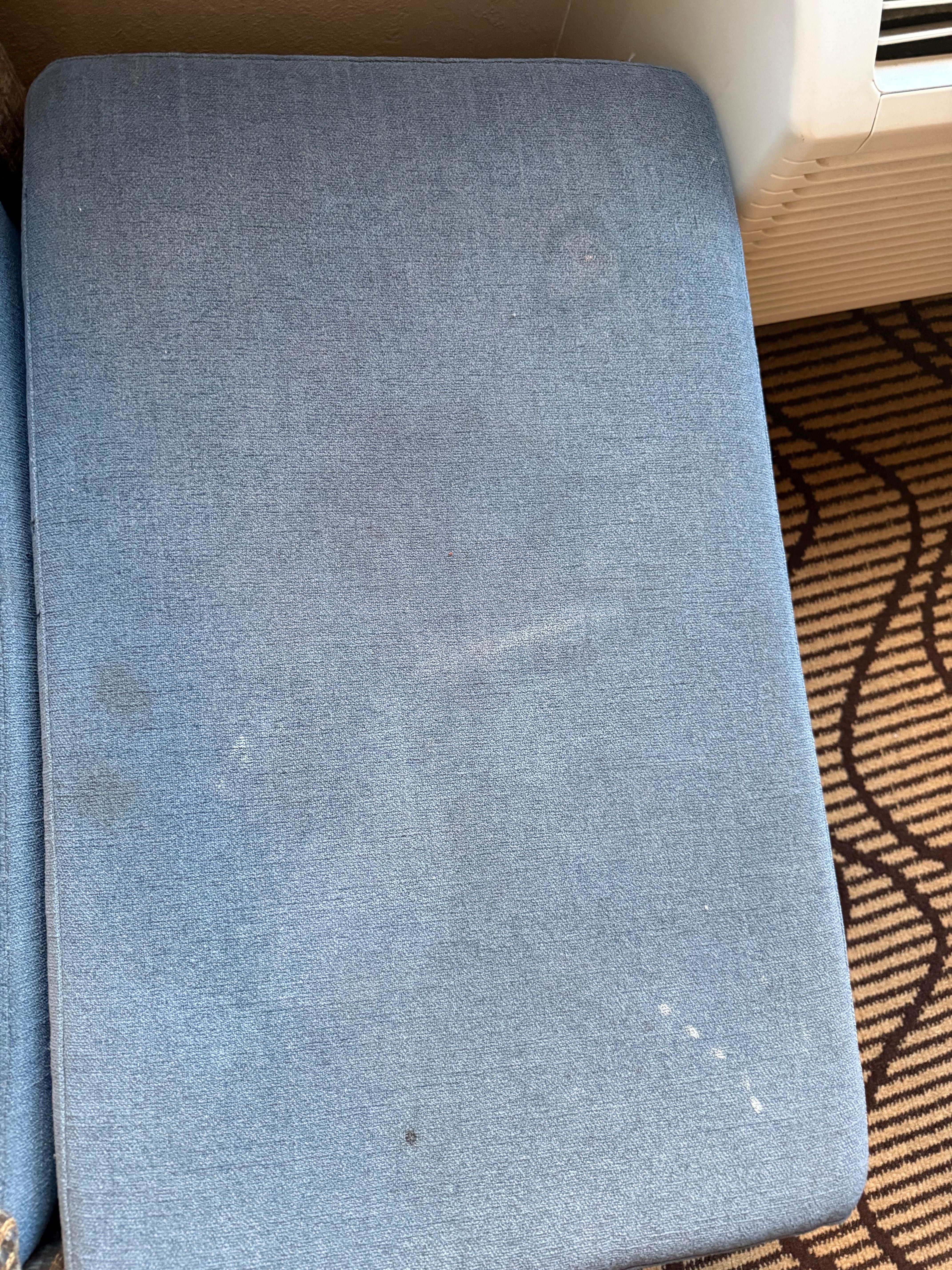Heavily stained upholstery. 