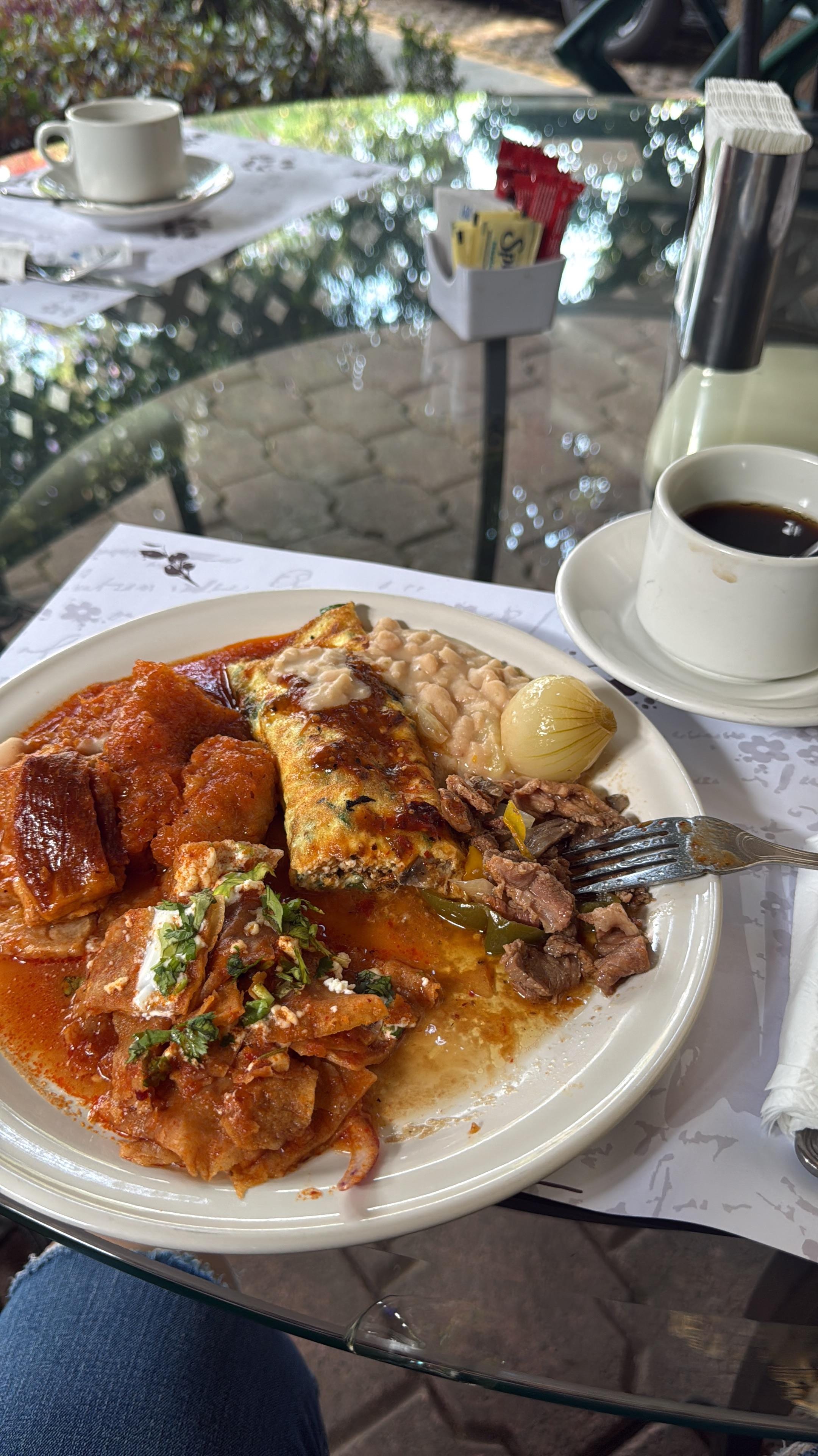 Some of the breakfast options chilaquiles, chicharron, beans, egg omelette and bistek