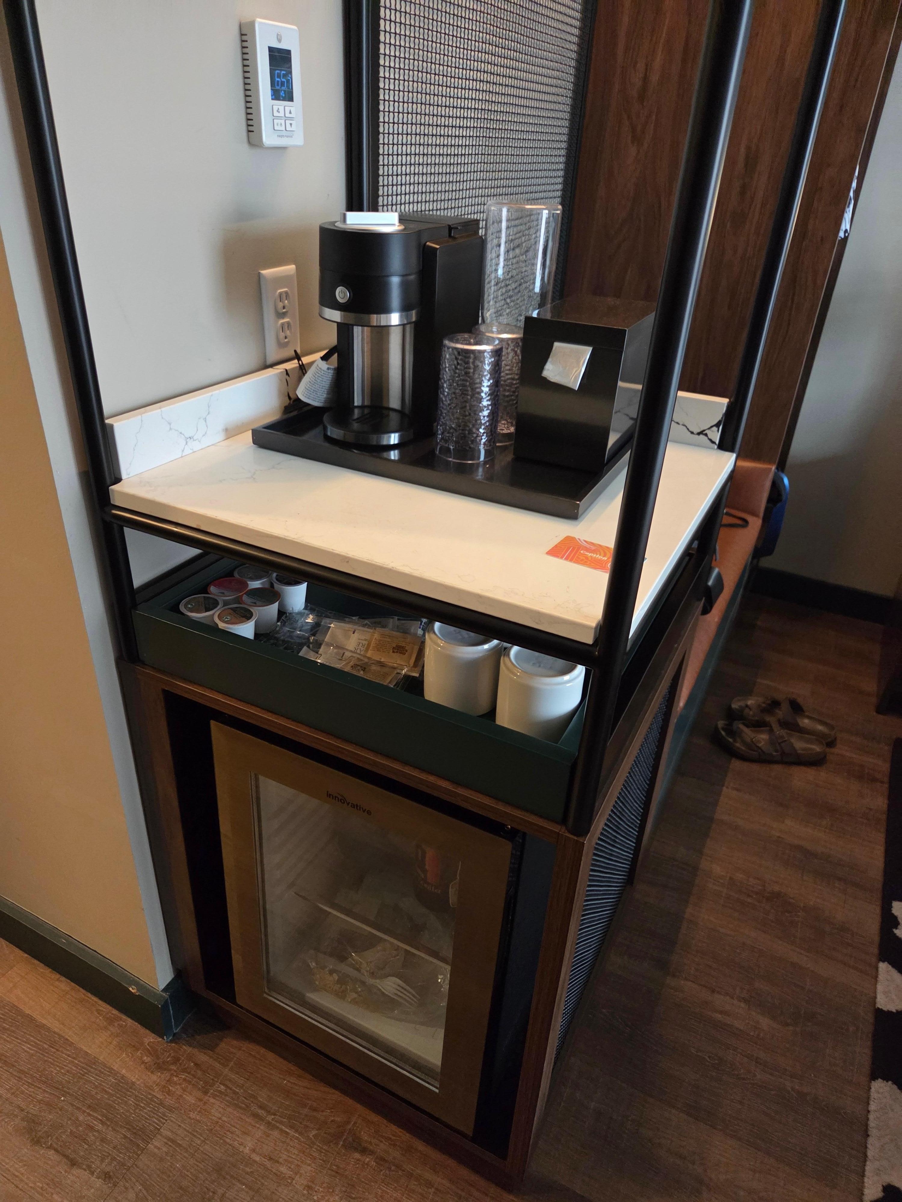Mini fridge, coffee, tea area.