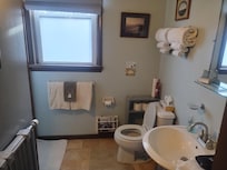 Private bathroom with bath robes, hairdryer, linens and hygiene products provided