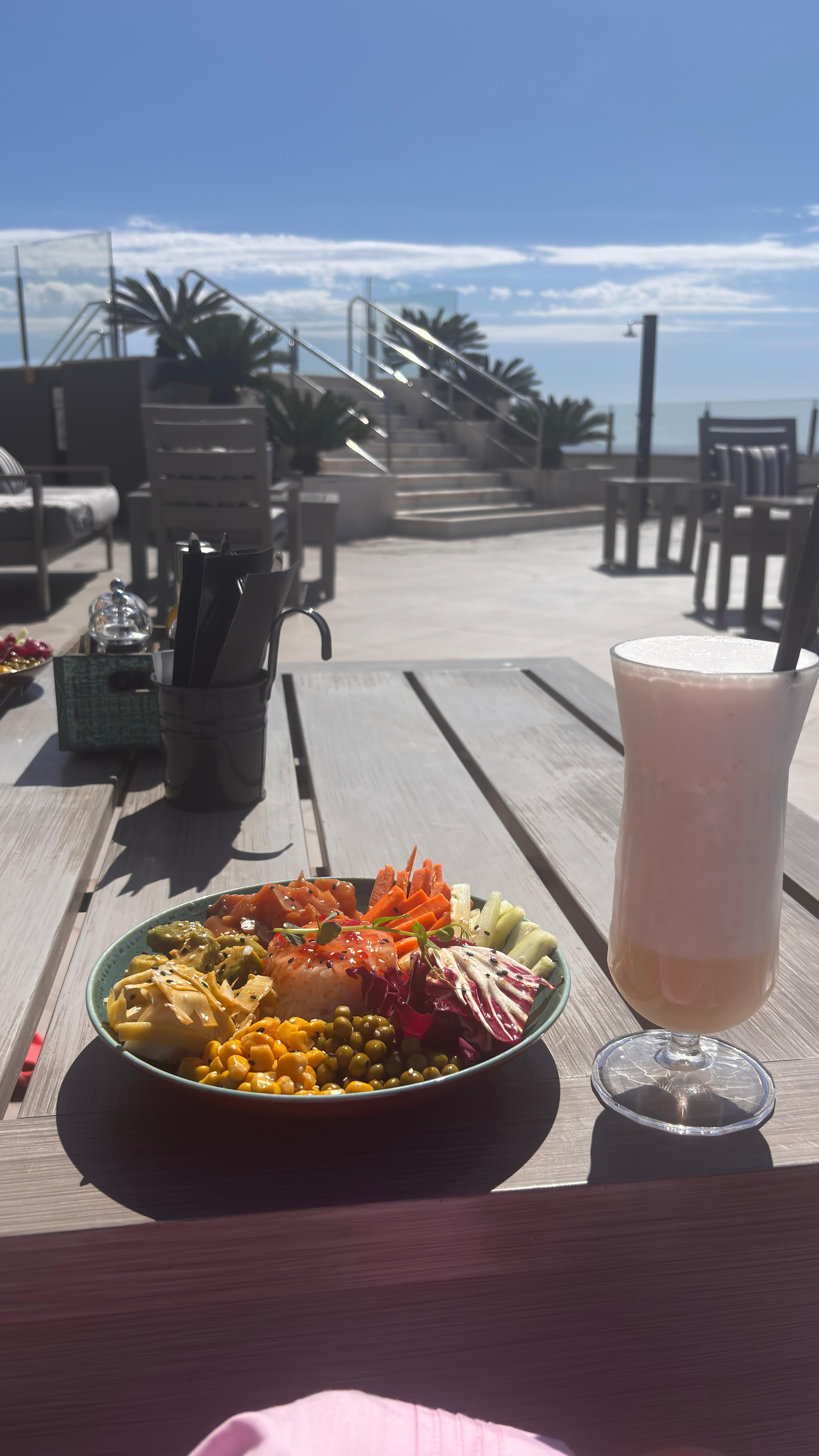 Salmon poke bowl in rooftop bar 
