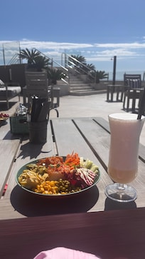 Salmon poke bowl in rooftop bar