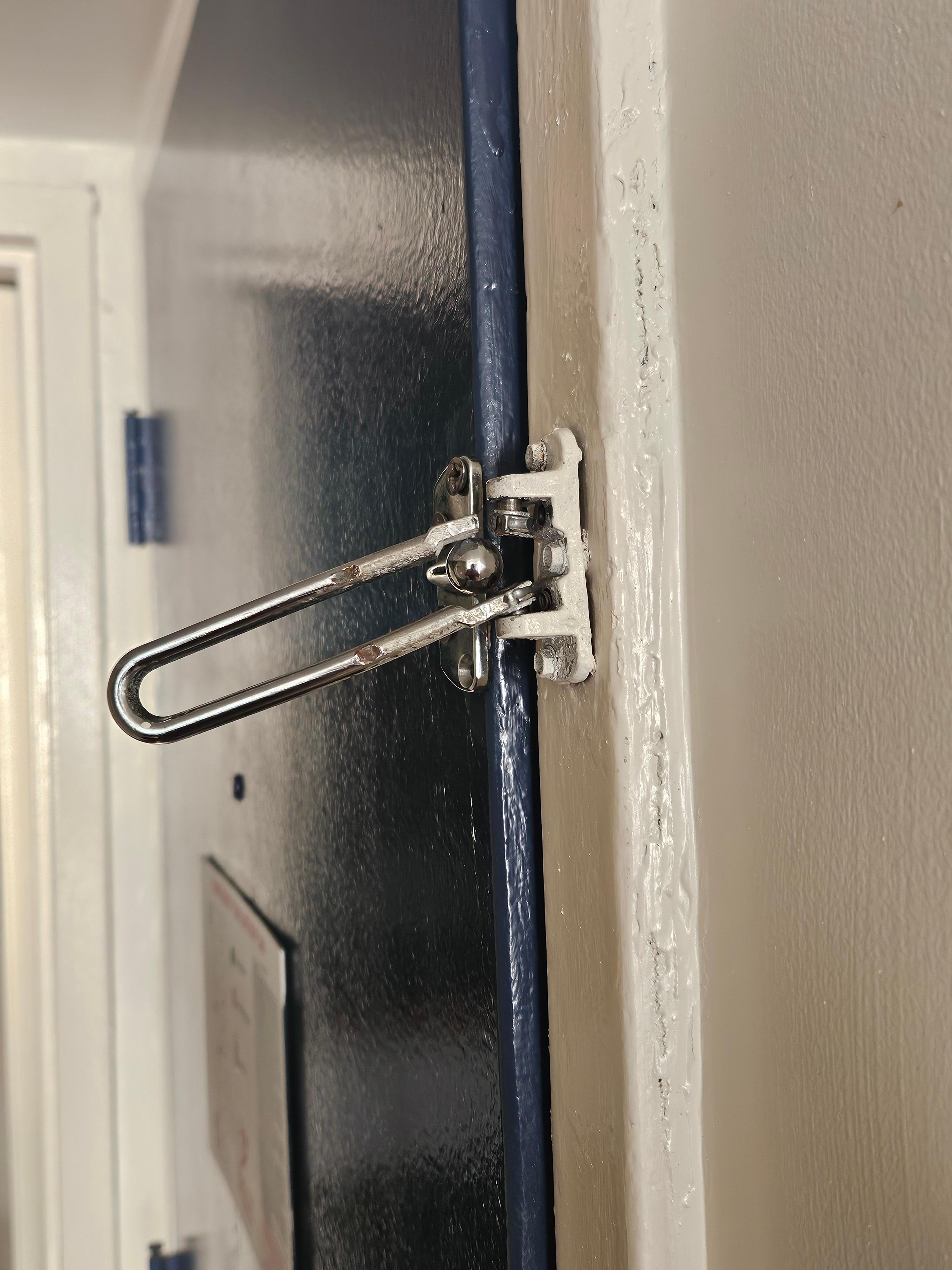 Broken lock and warped door. 