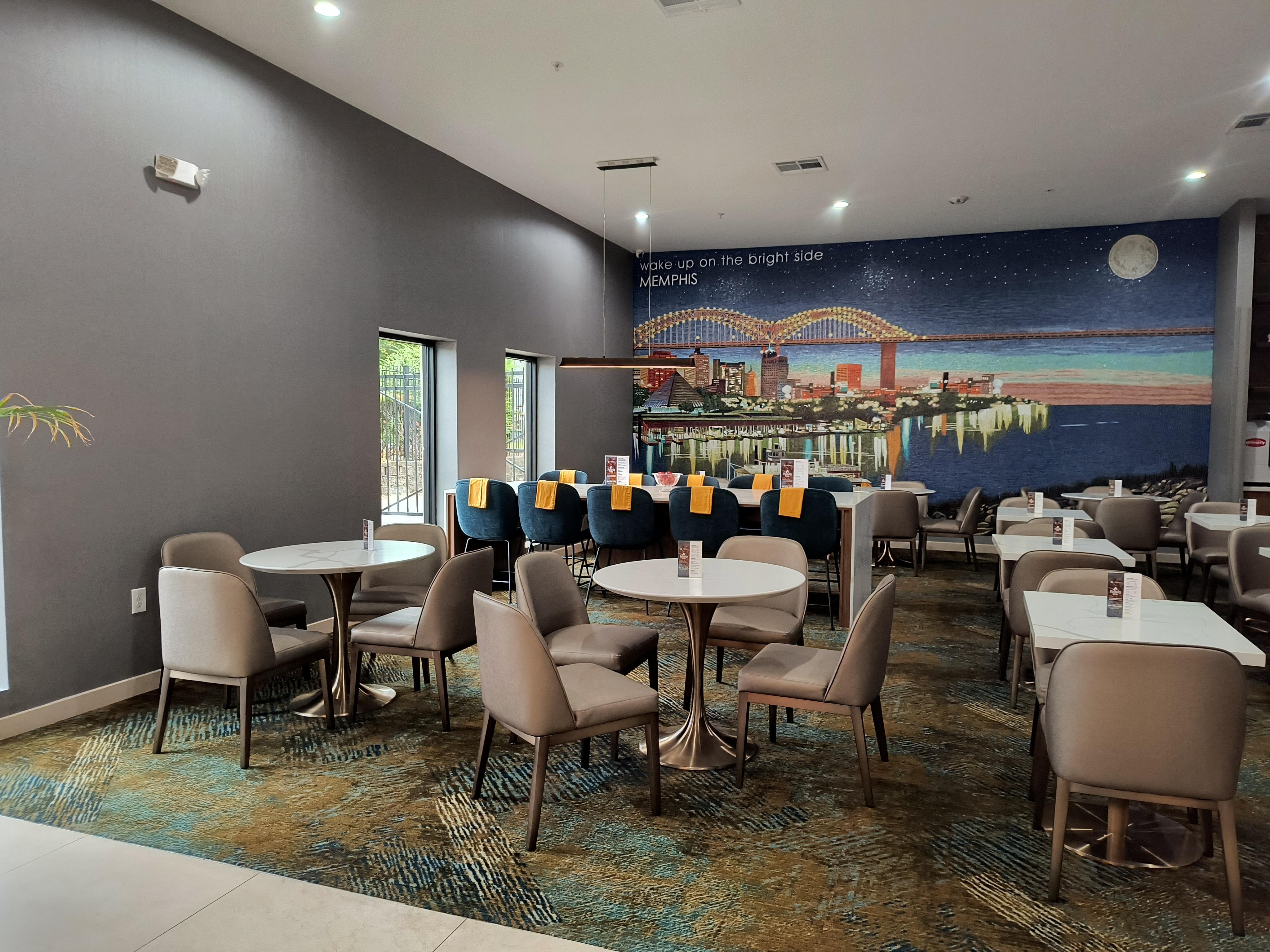 Dining area has a cool art wall