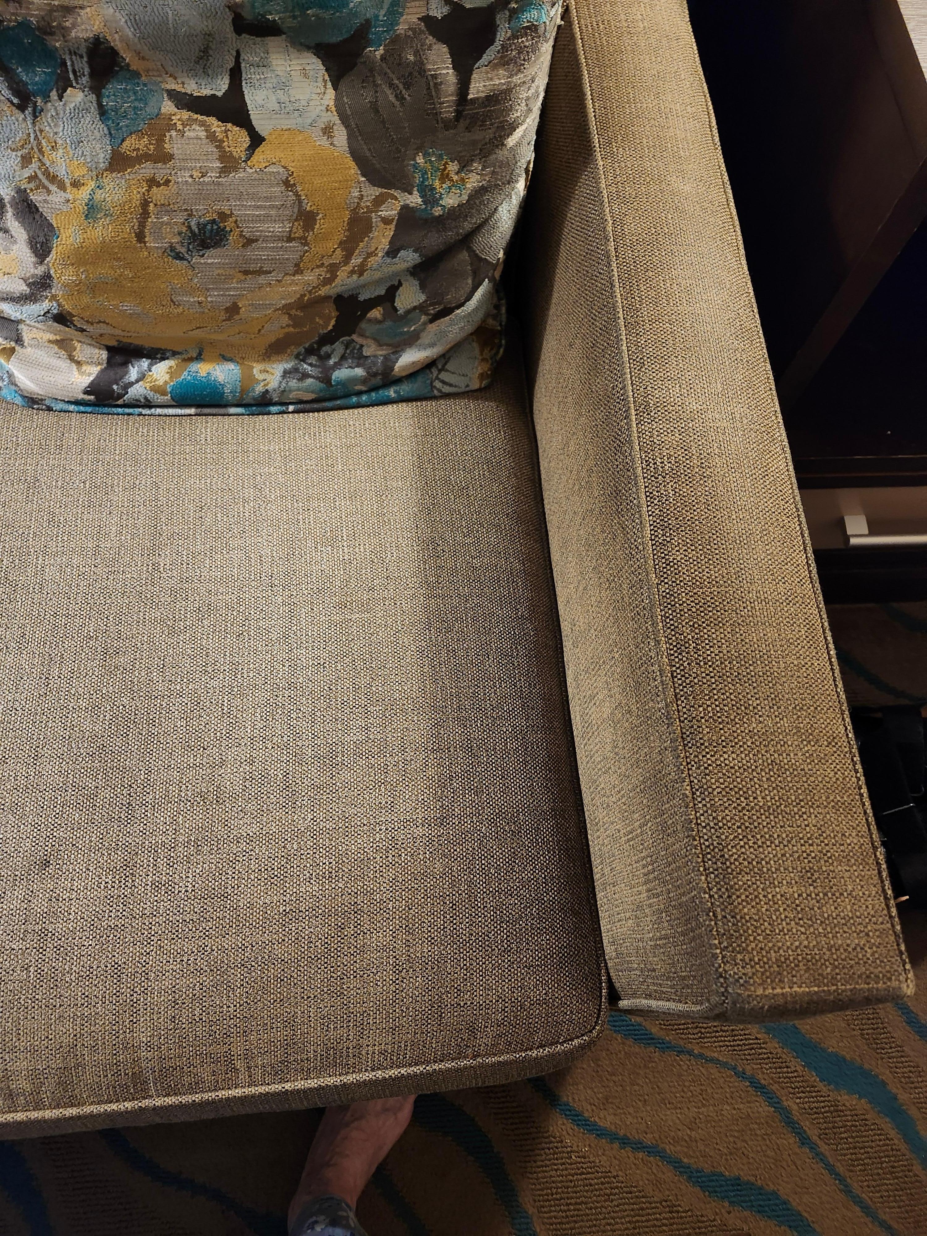 Sofa arms dirty & old.