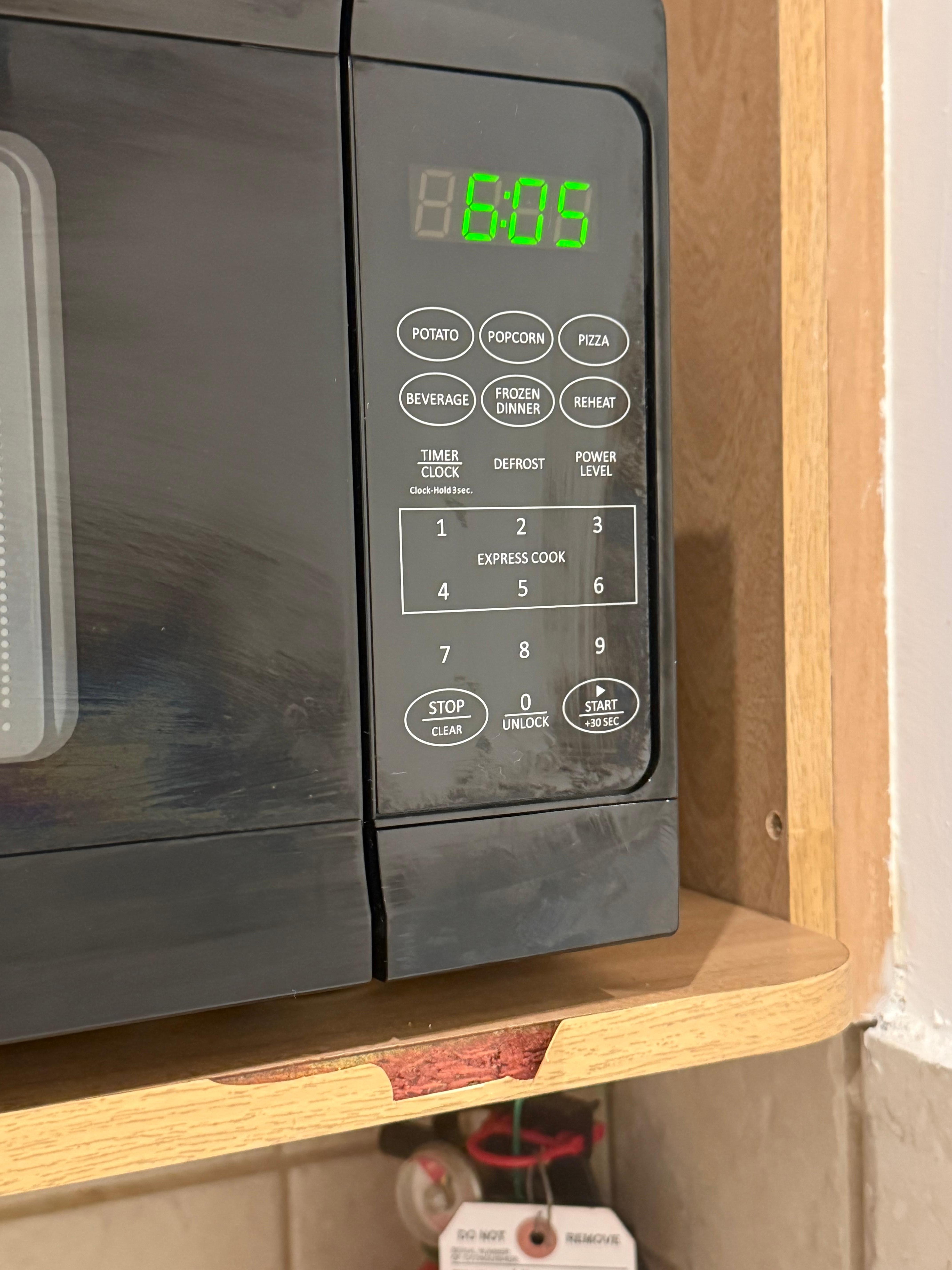 Microwave and other appliances were dirty as shown