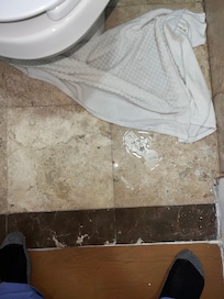 Wet towel soaked from toilet leak