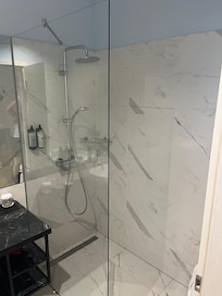 Not enough hooks for the towels and no dryer line for swimsuits. Decor is very modern!