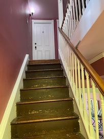 The stairs and door to our room.