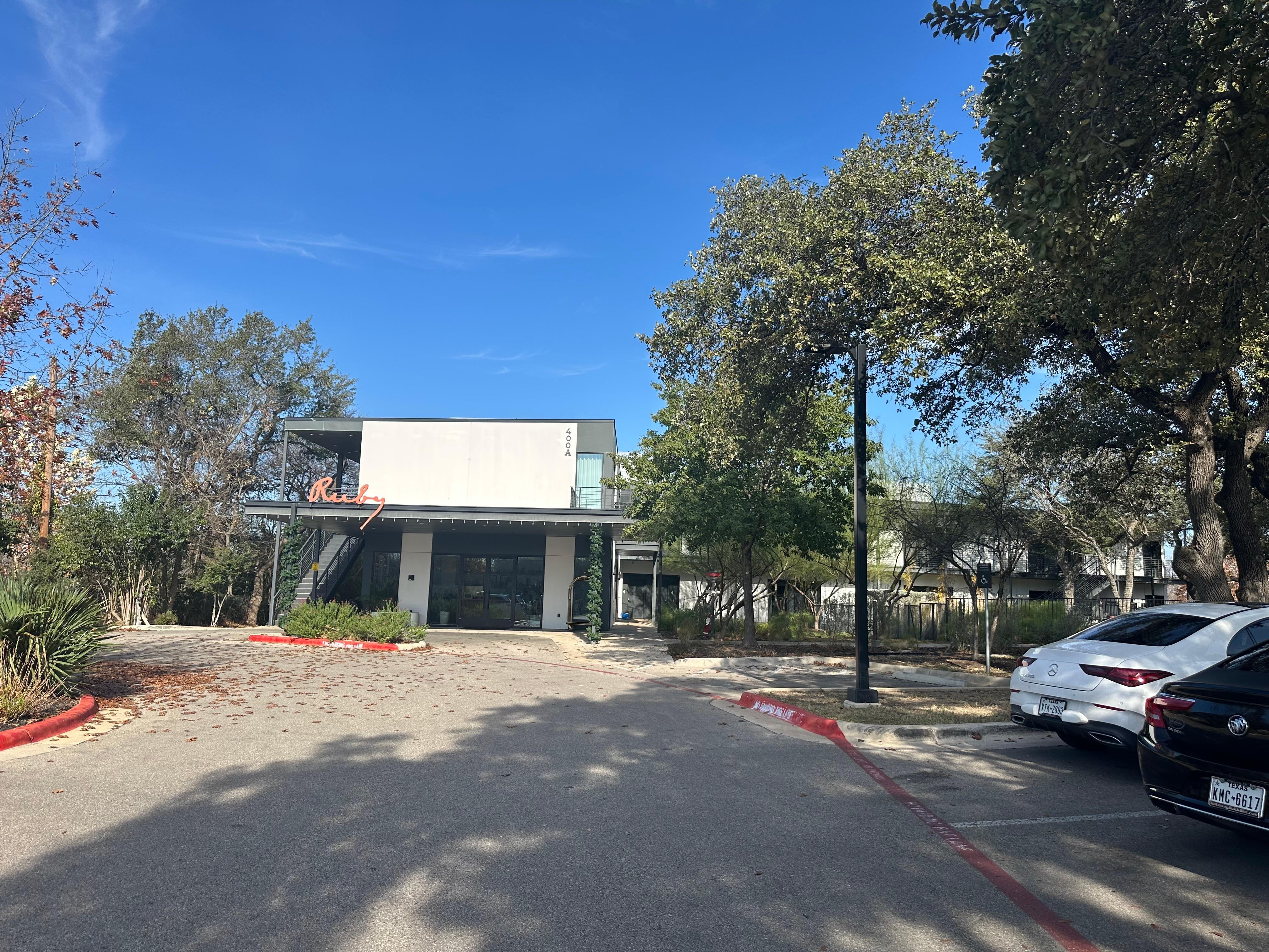 Front of hotel and parking area