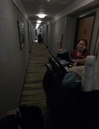 Staff member who was sitting by her cart outside of our door.