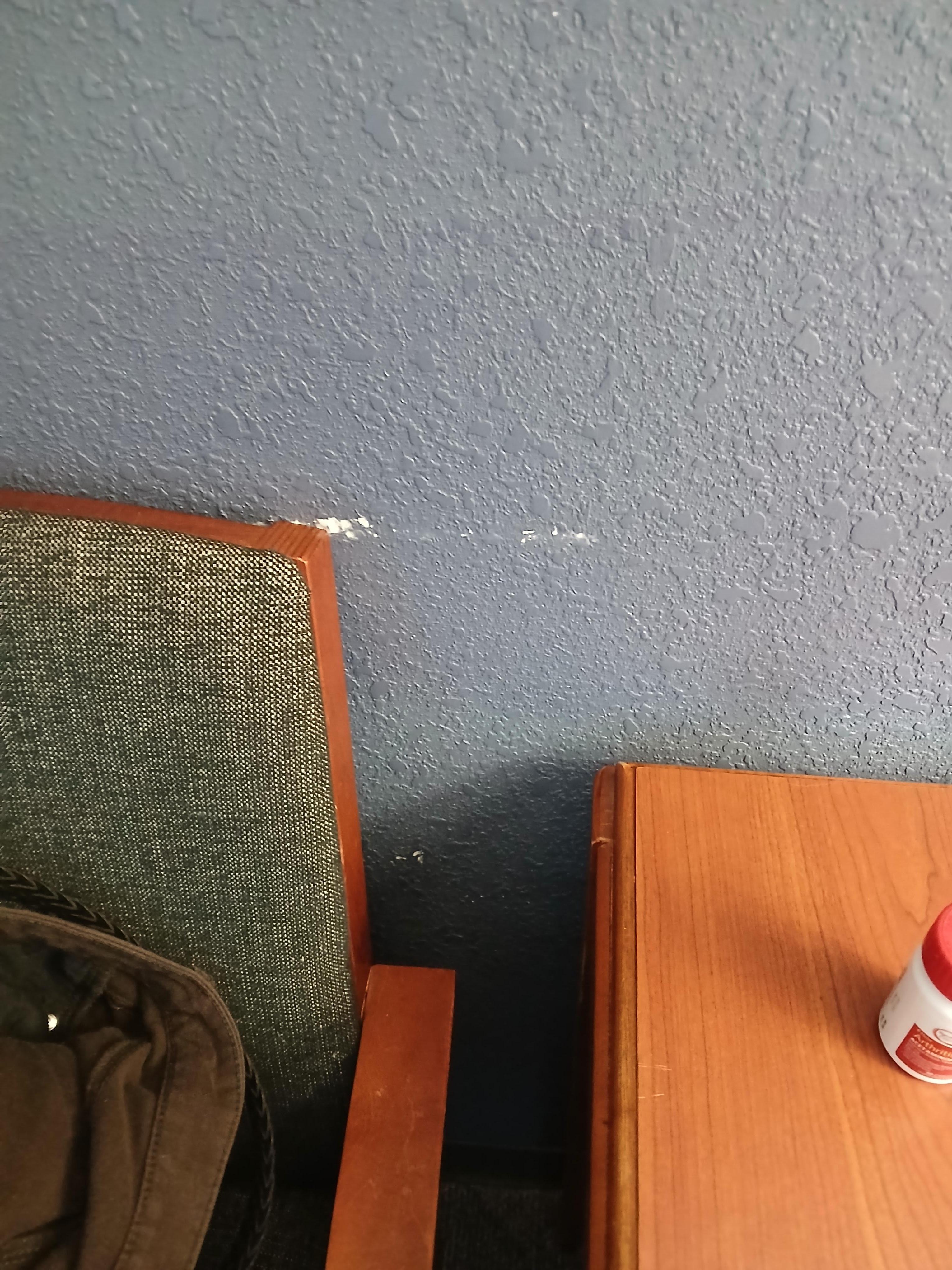 Chipped paintwork all over the room.