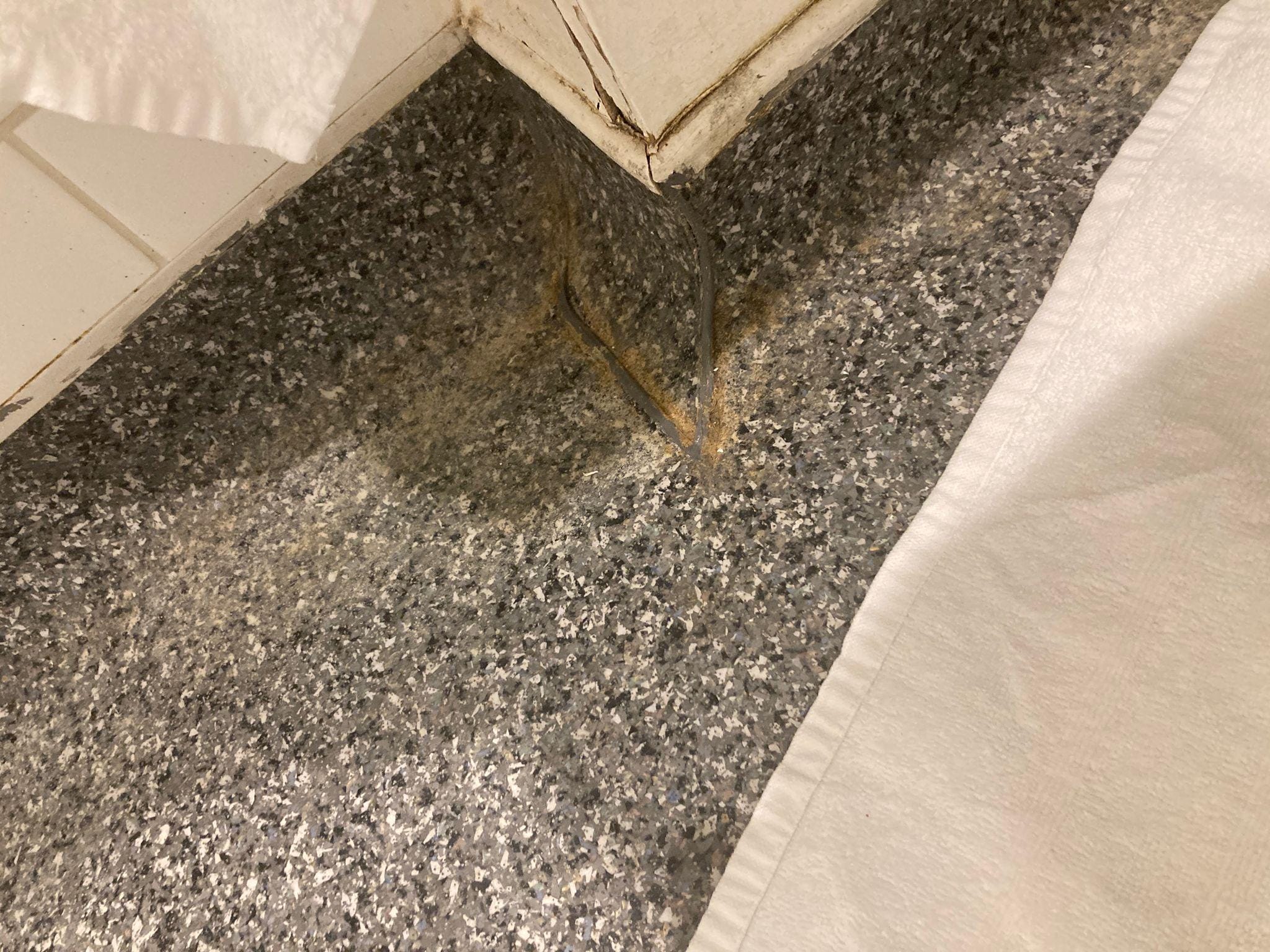 Grime in bathroom under sink